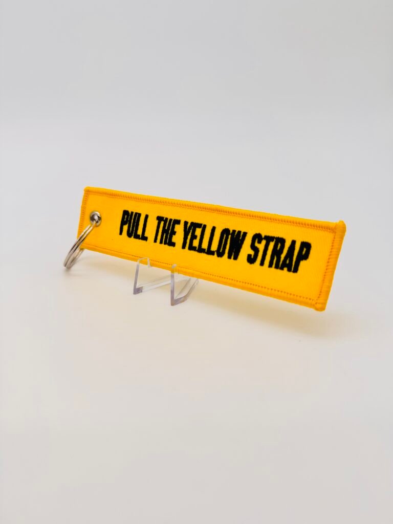 Porte Clé Pull the yellow strap - Parcs Actus
